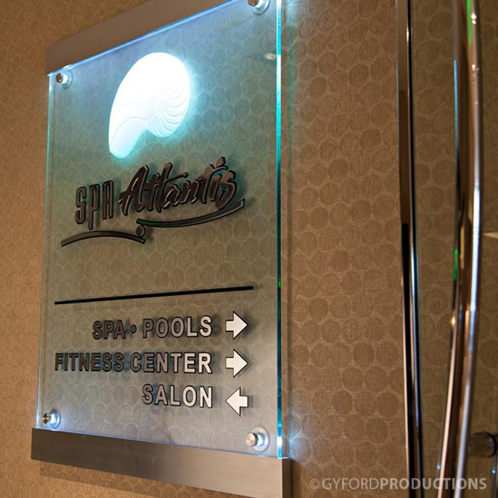 LED standoffs light up the sanded edge of this acrylic sign. The ...